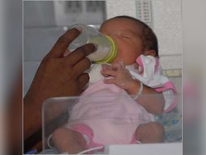 Baby Manji arrives to unite with Japanese dad