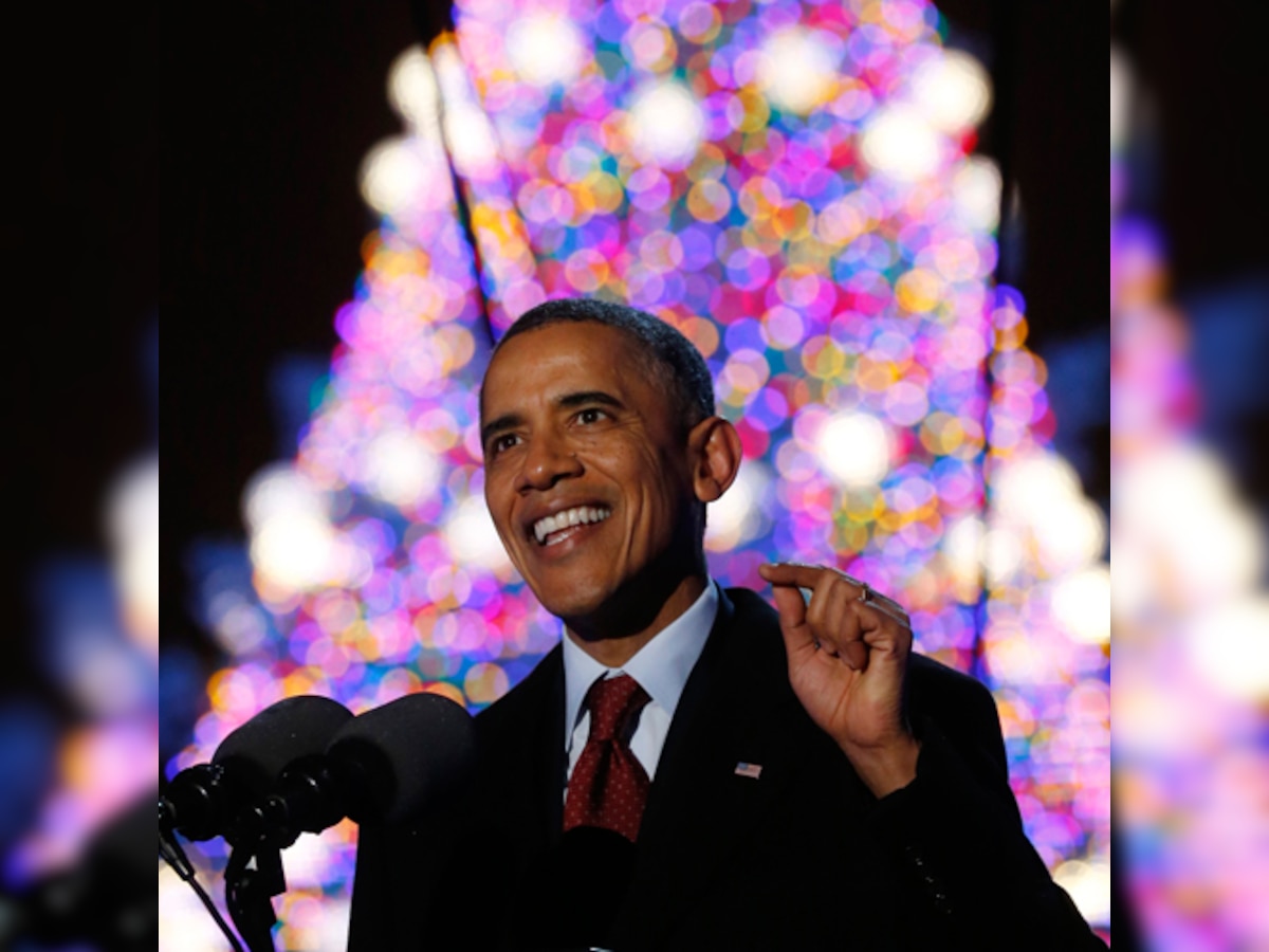 Barack Obama lights up National Christmas Tree while grooving with elf