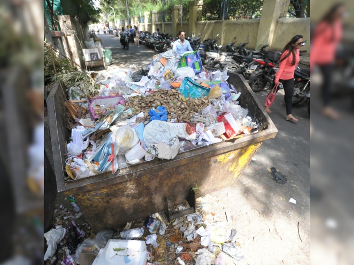 Overflowing garbage bins leave city stinking in monsoon