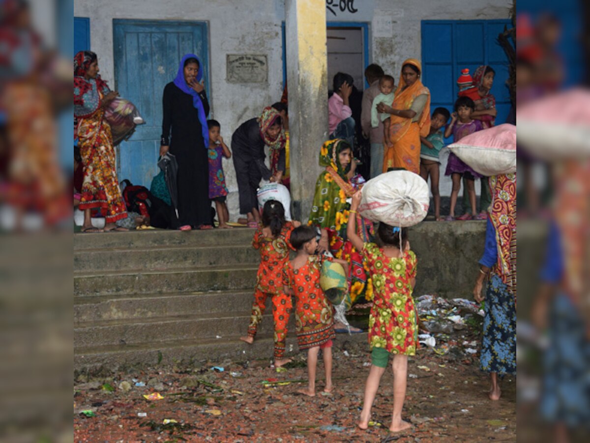 Cyclone Komen forces evacuation of thousands in Bangladesh
