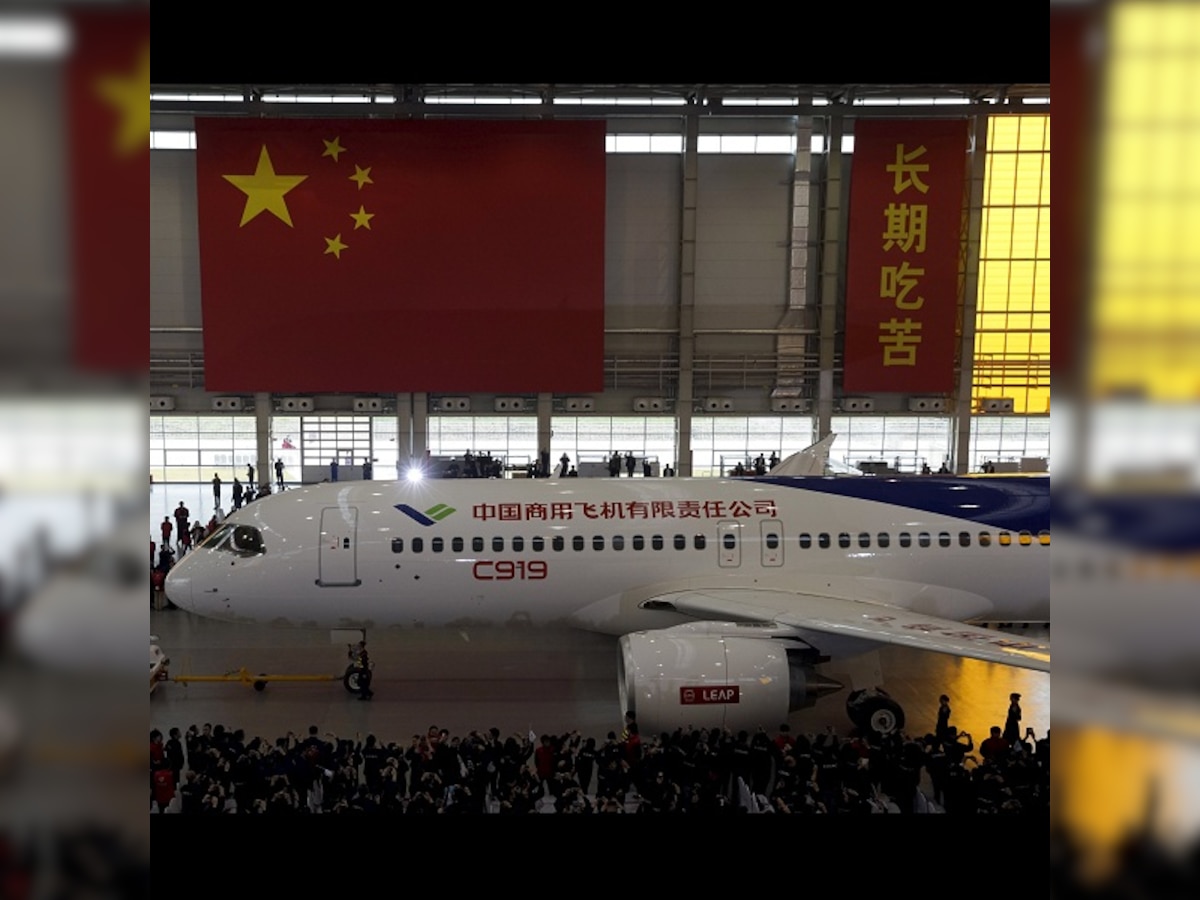 China unveils first big passenger jet to vie with Boeing, Airbus