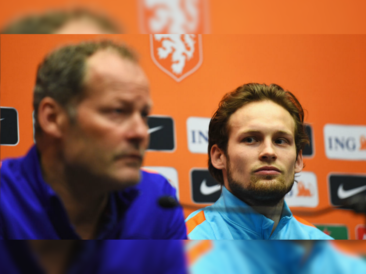 Man United's Daley Blind stands in support of his father who was sacked ...