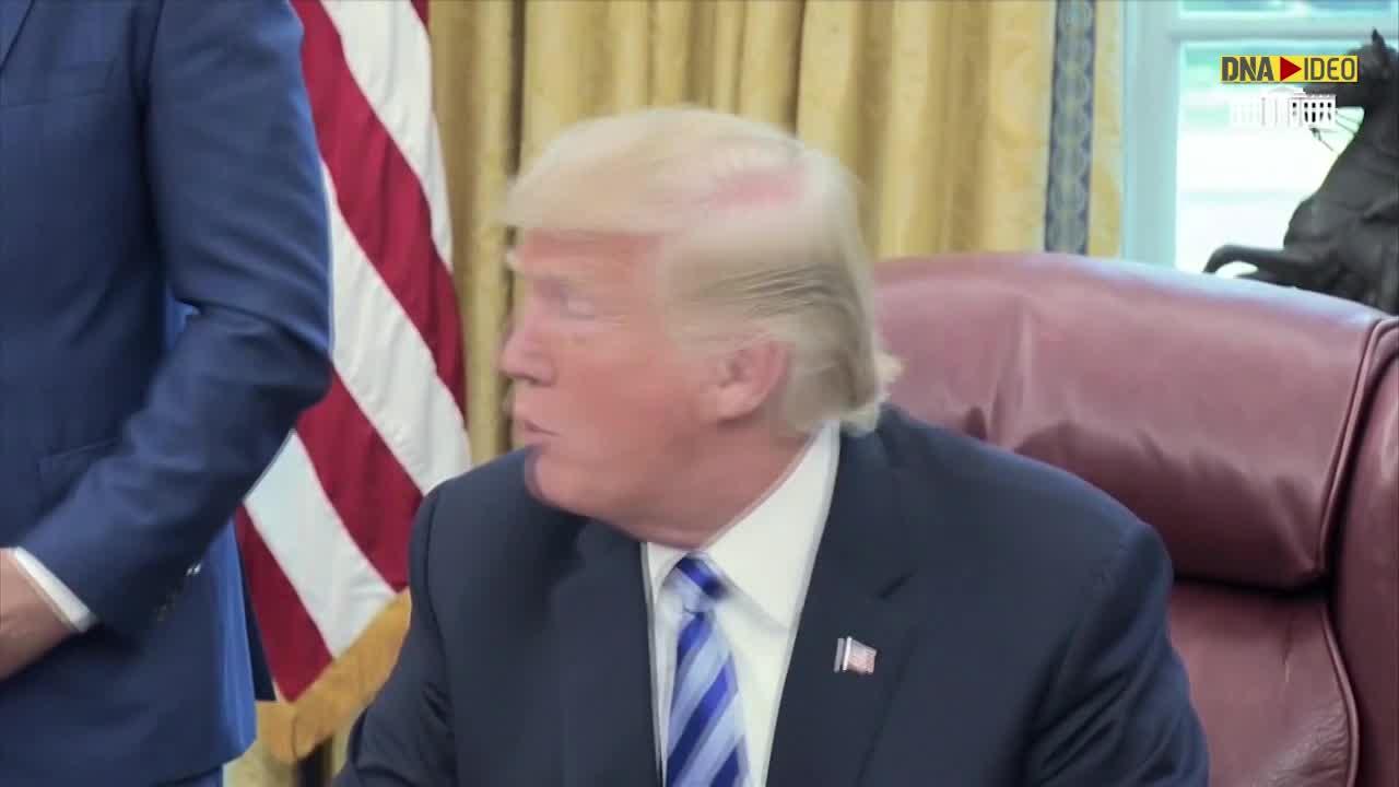 US President Donald Trump shows red card to media during FIFA meeting