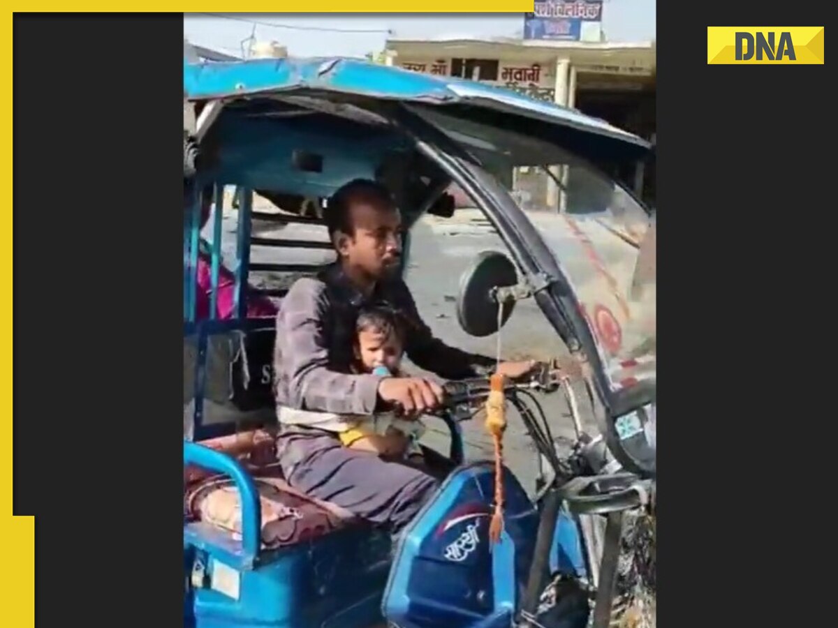 Viral pic: UP man drives e-rickshaw with infant daughter strapped to ...
