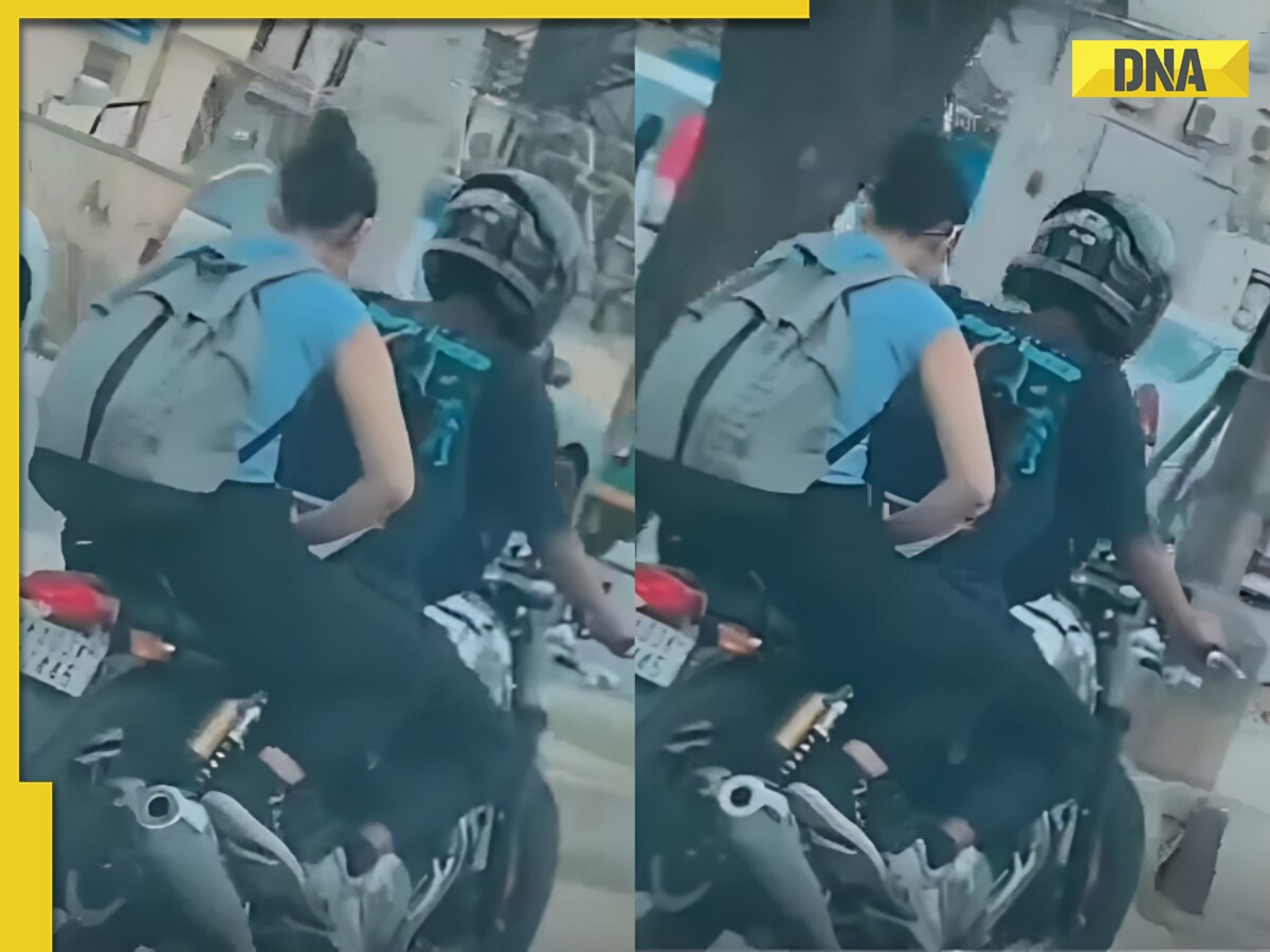 Bengaluru: Helmetless woman on bike works on laptop, viral video sparks ...