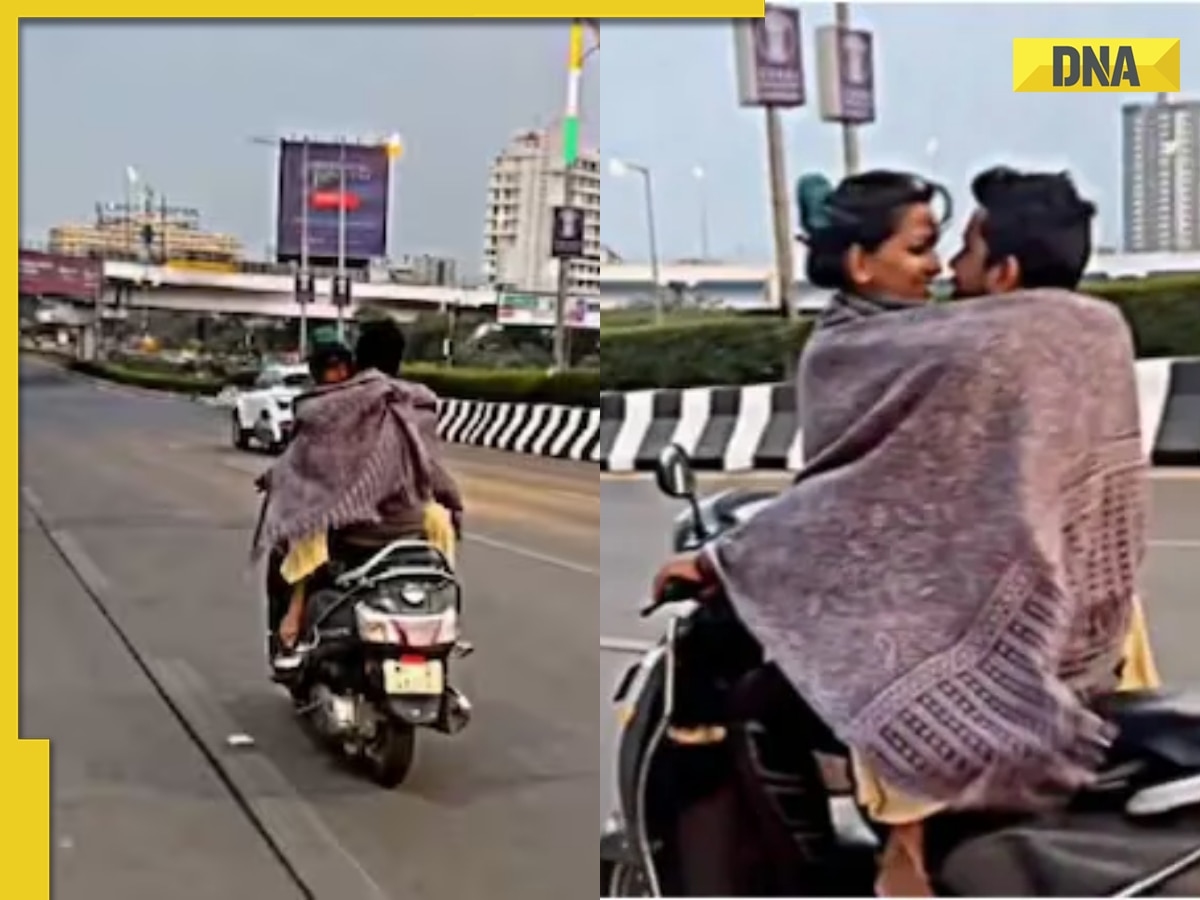 Viral video: Mumbai couple’s romance on moving scooter under blanket sparks internet backlash