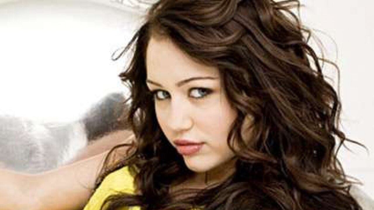 Miley Cyrus gives sneak peak of breast tattoo at MTV Awards