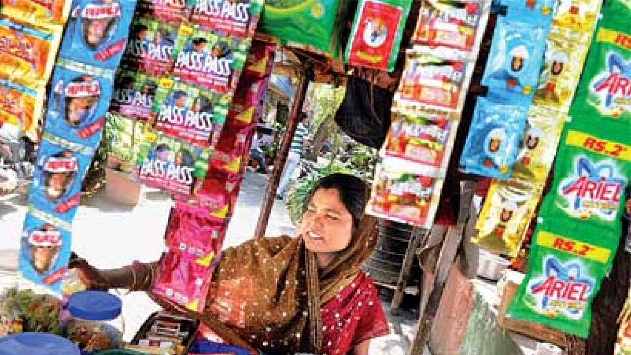 Selling cigarettes in a market of men