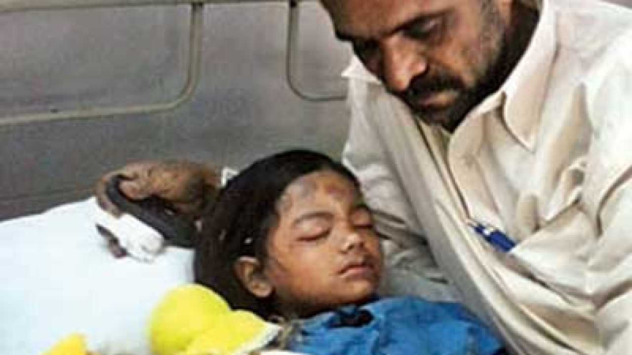 Thane collapse: Girl with a doll walks out of the rubble?