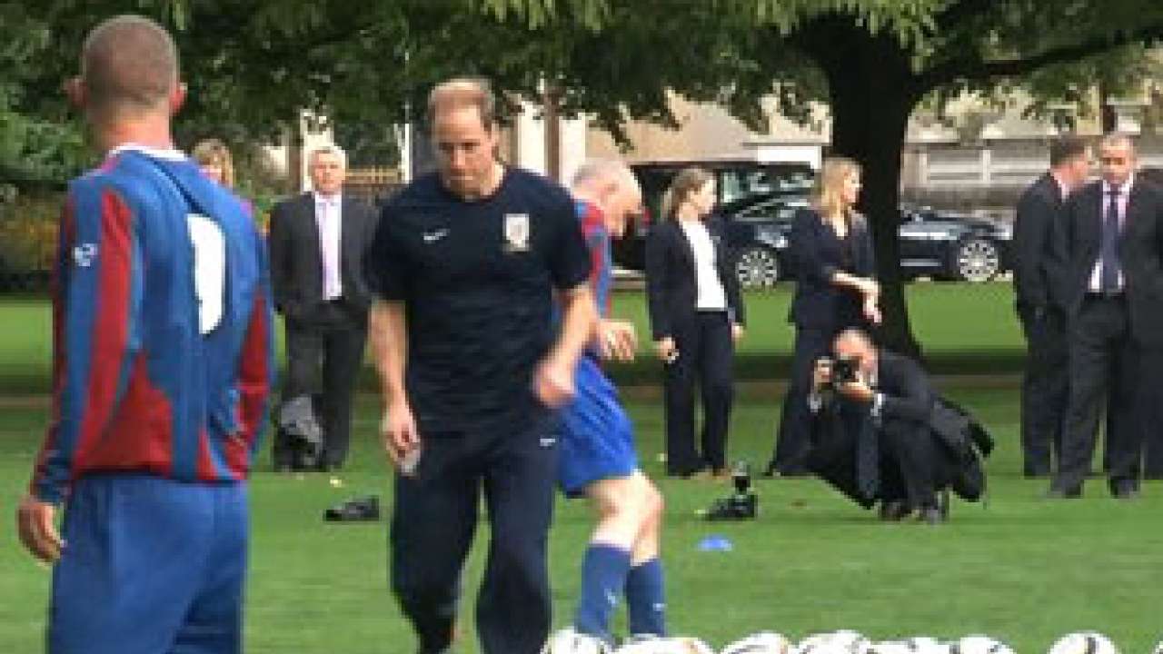 Prince William shows off his football skills at match in Buckingham ...