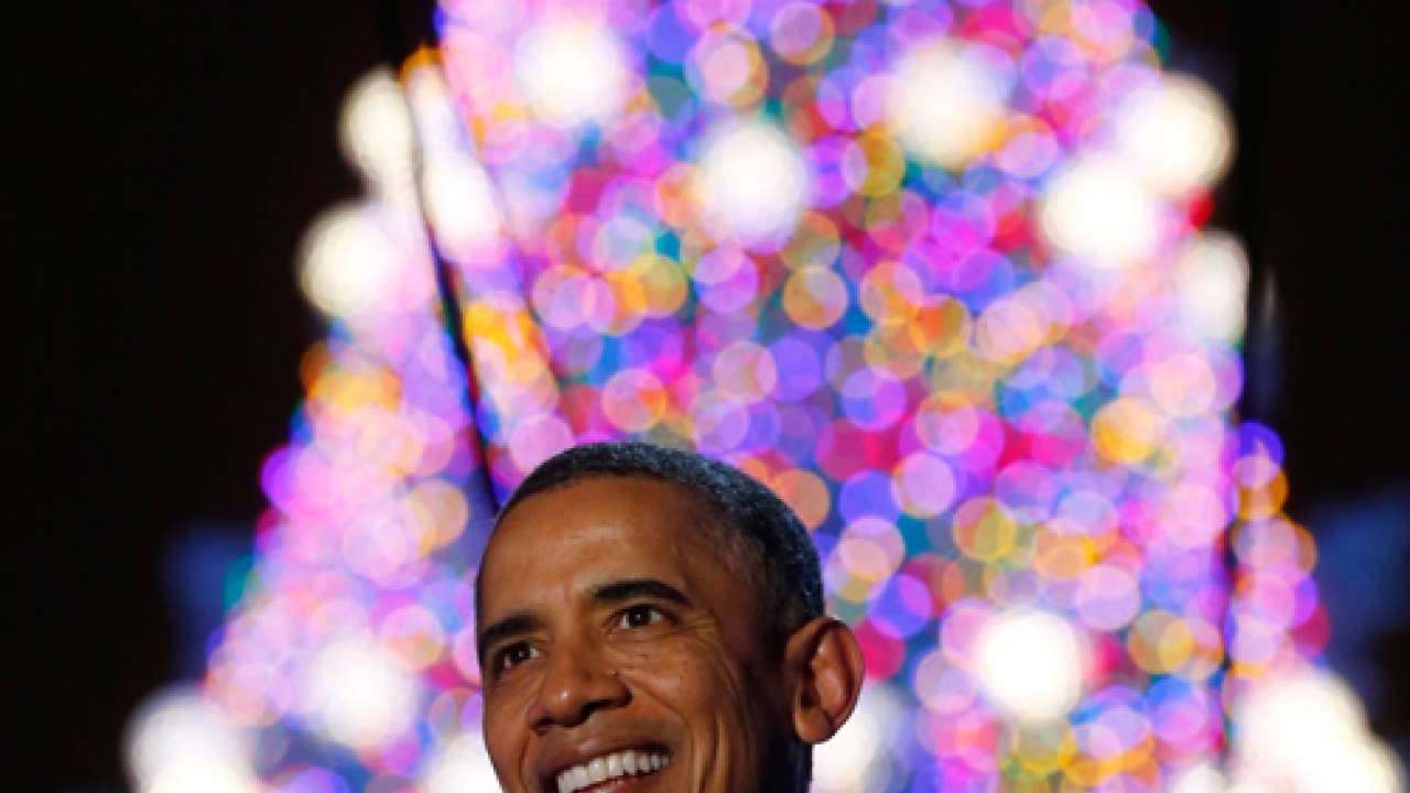 Barack Obama lights up National Christmas Tree while grooving with elf
