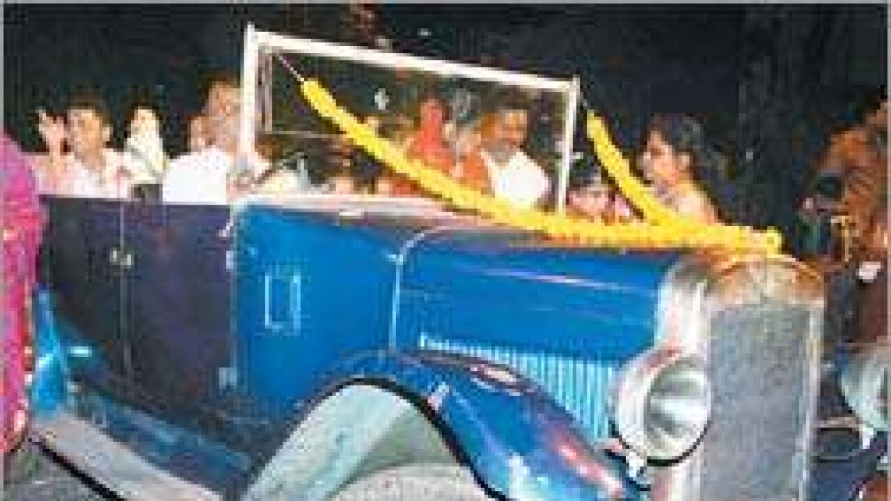 Ganesha drives home in a vintage Austin on his B’day
