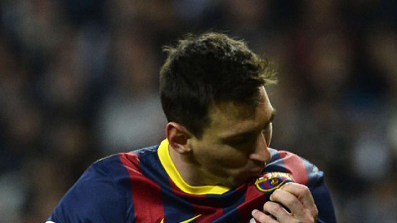 Lionel Messi blows title race open with treble at Real Madrid