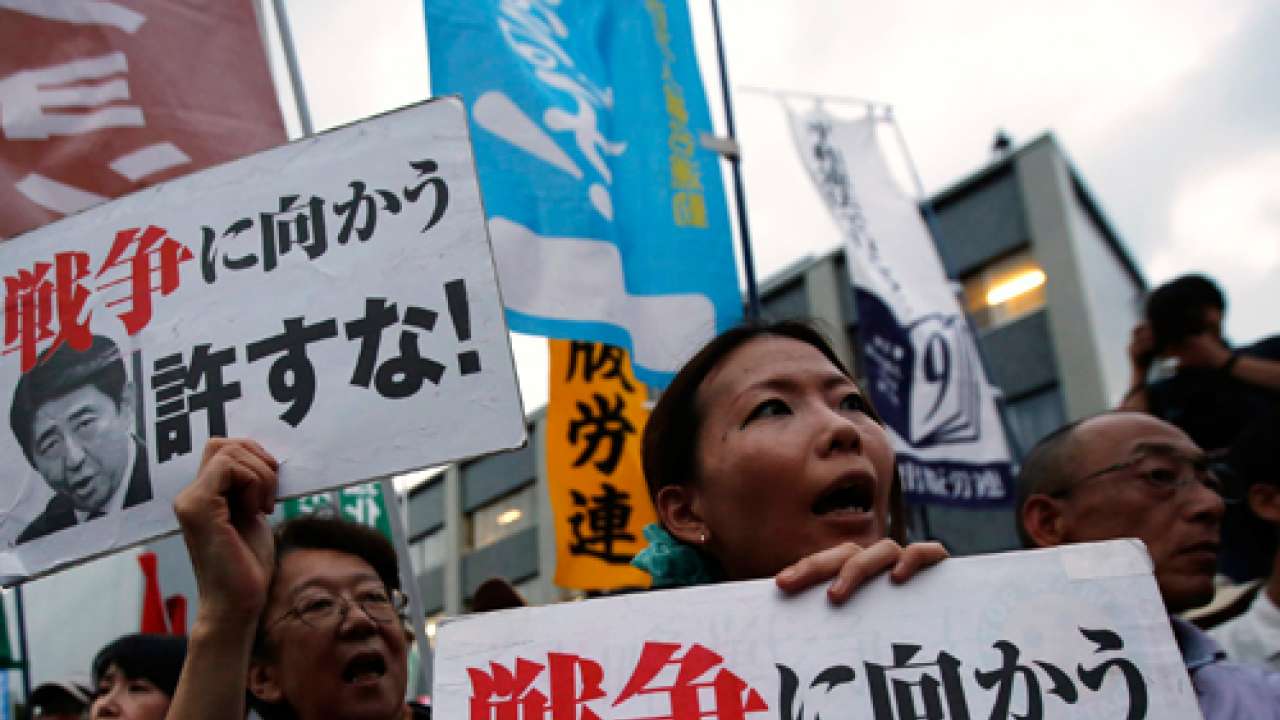 Japan takes historic step away from post-war pacifism, ends ban on ...