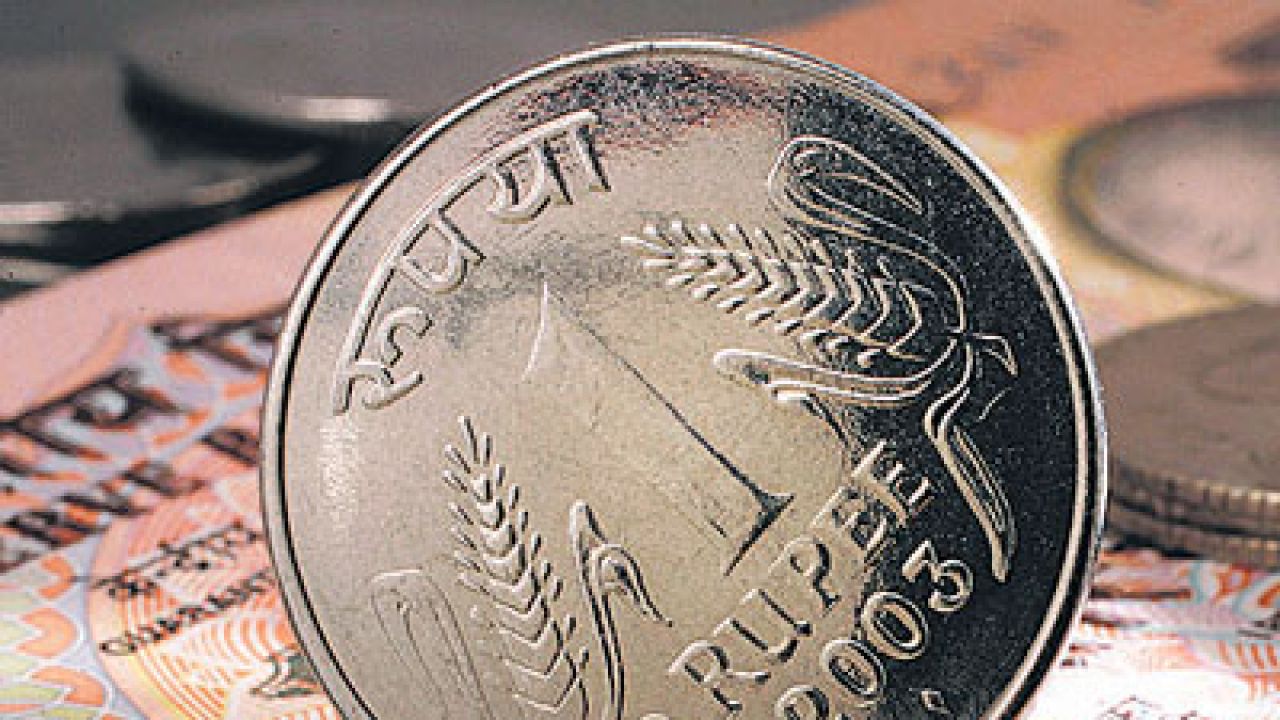 Rupee drops to 9 month low, down 18 paise to 62.14