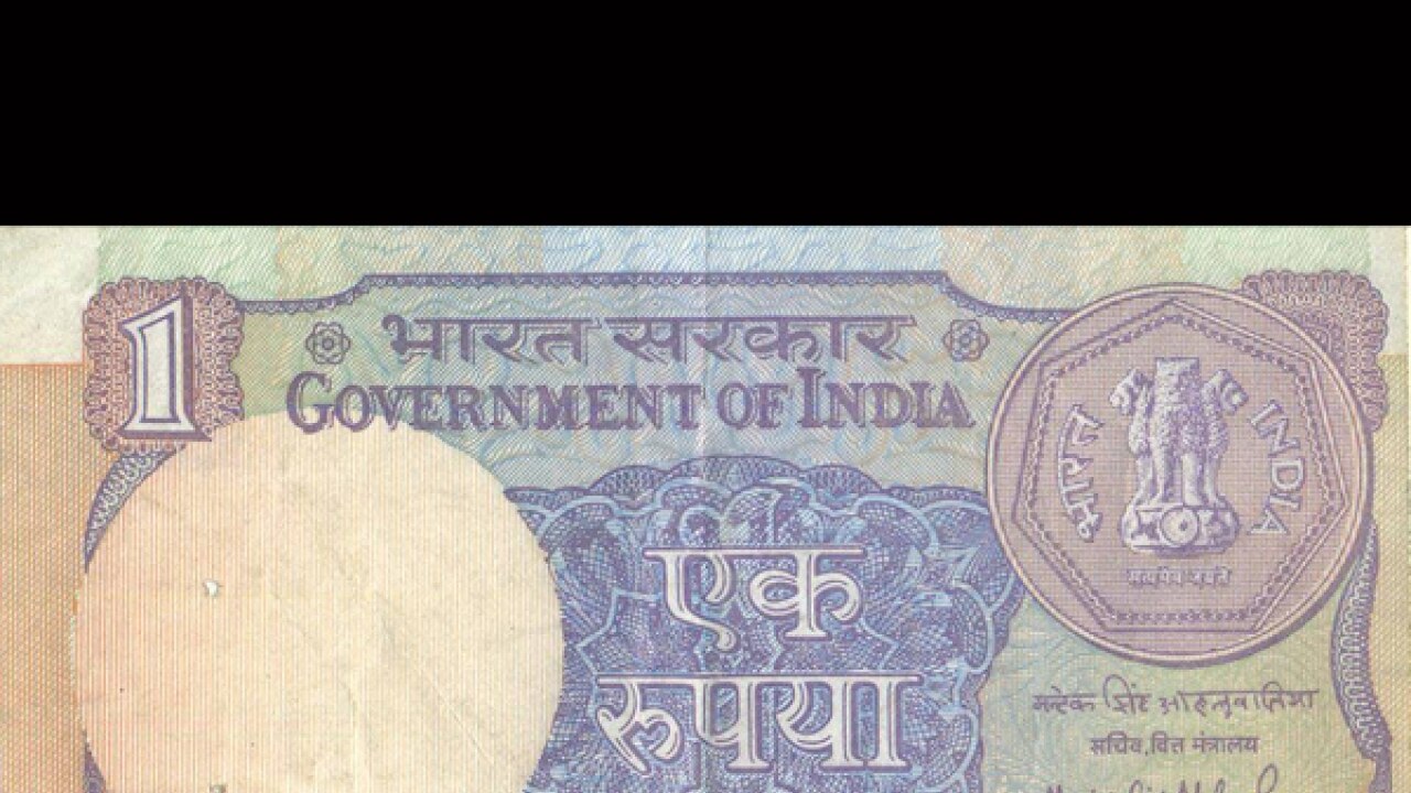 Rupee gains against dollar, below 64-mark