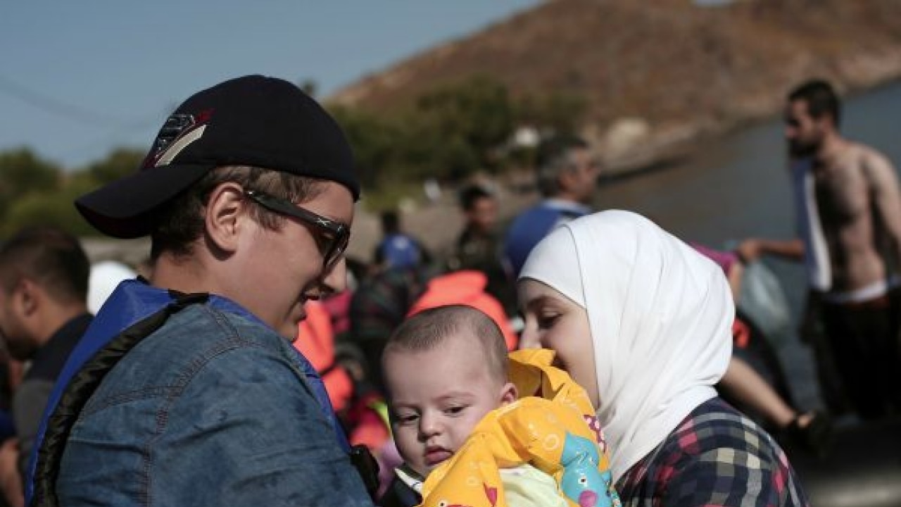 Struggling Germany urges neighbours to do more to ease refugee crisis