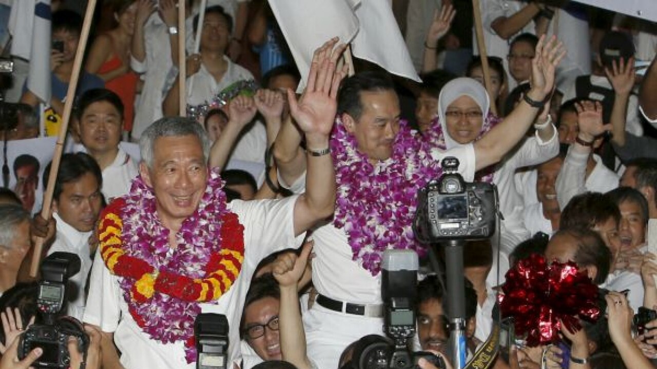Singapore ruling party in decisive win as voters shun risk