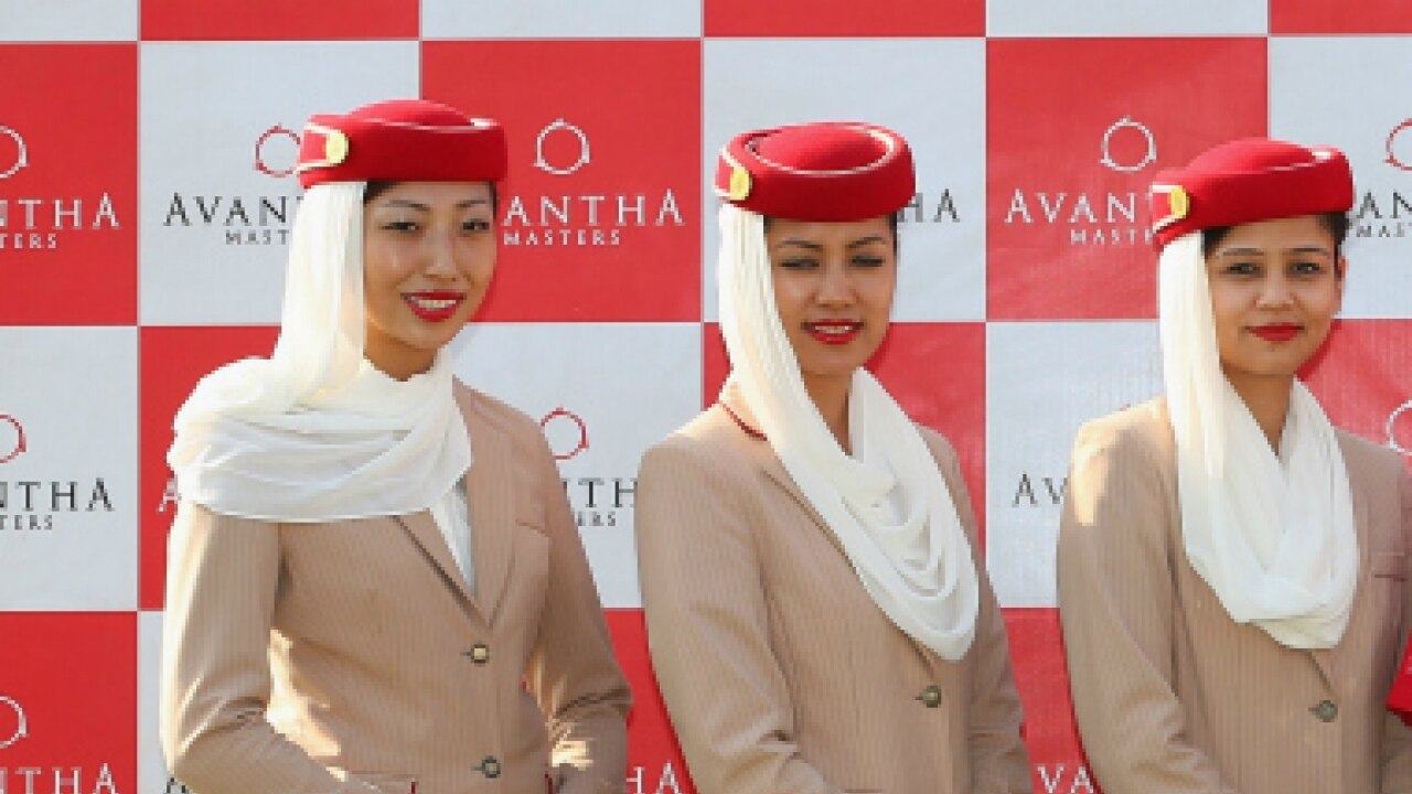 Air Hostesses show safety measures to be followed in football stadium