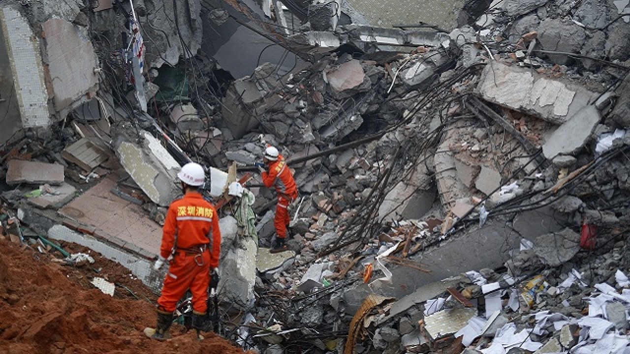 Rescuers pull first body from rubble of China landslide