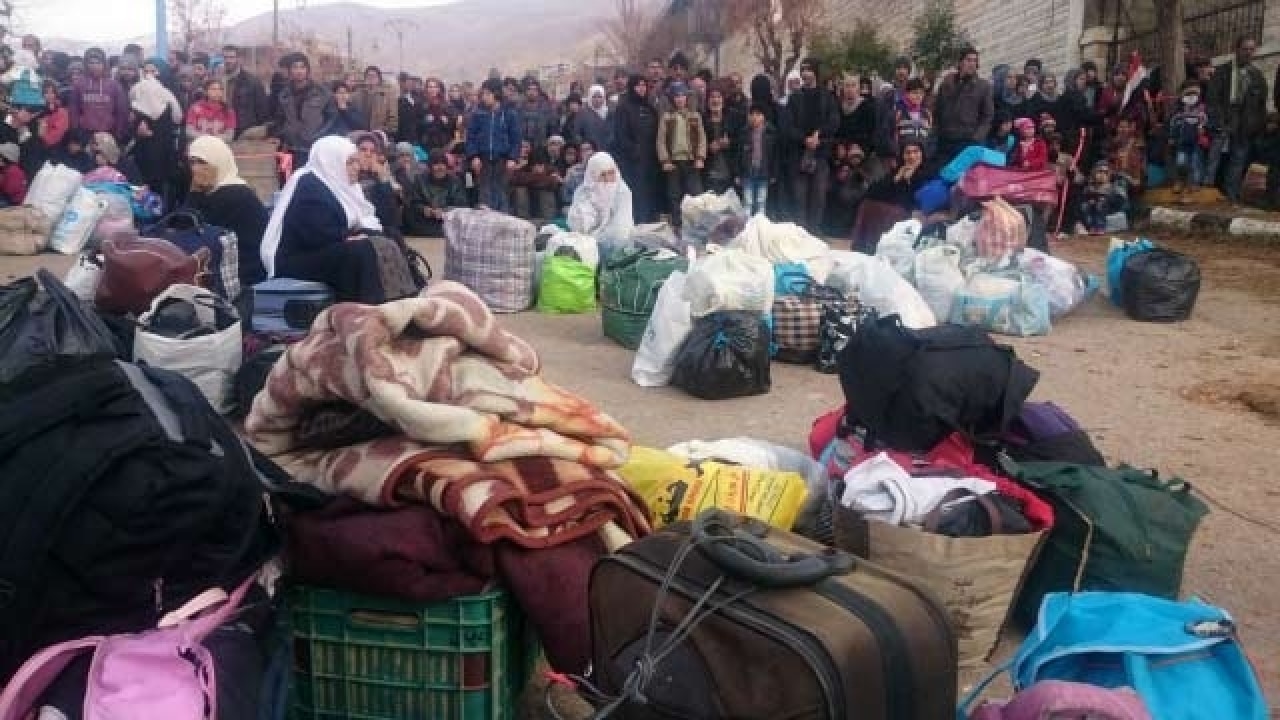 In besieged Syrian city, hungry residents sell gold for food