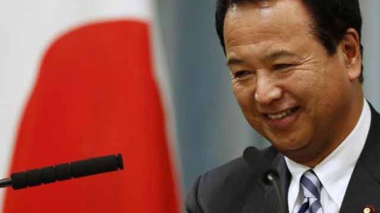 Japan's economy minister Akira Amari resigns over money scandal, denies ...