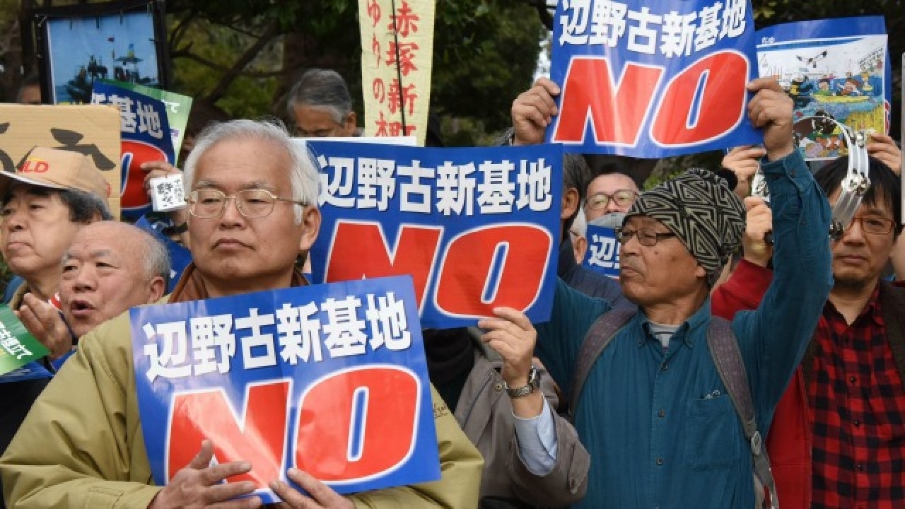 Thousands surround Japan parliament in protest at US base plan