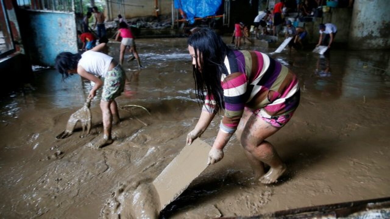 Five dead, tens of thousands flee Philippines floods