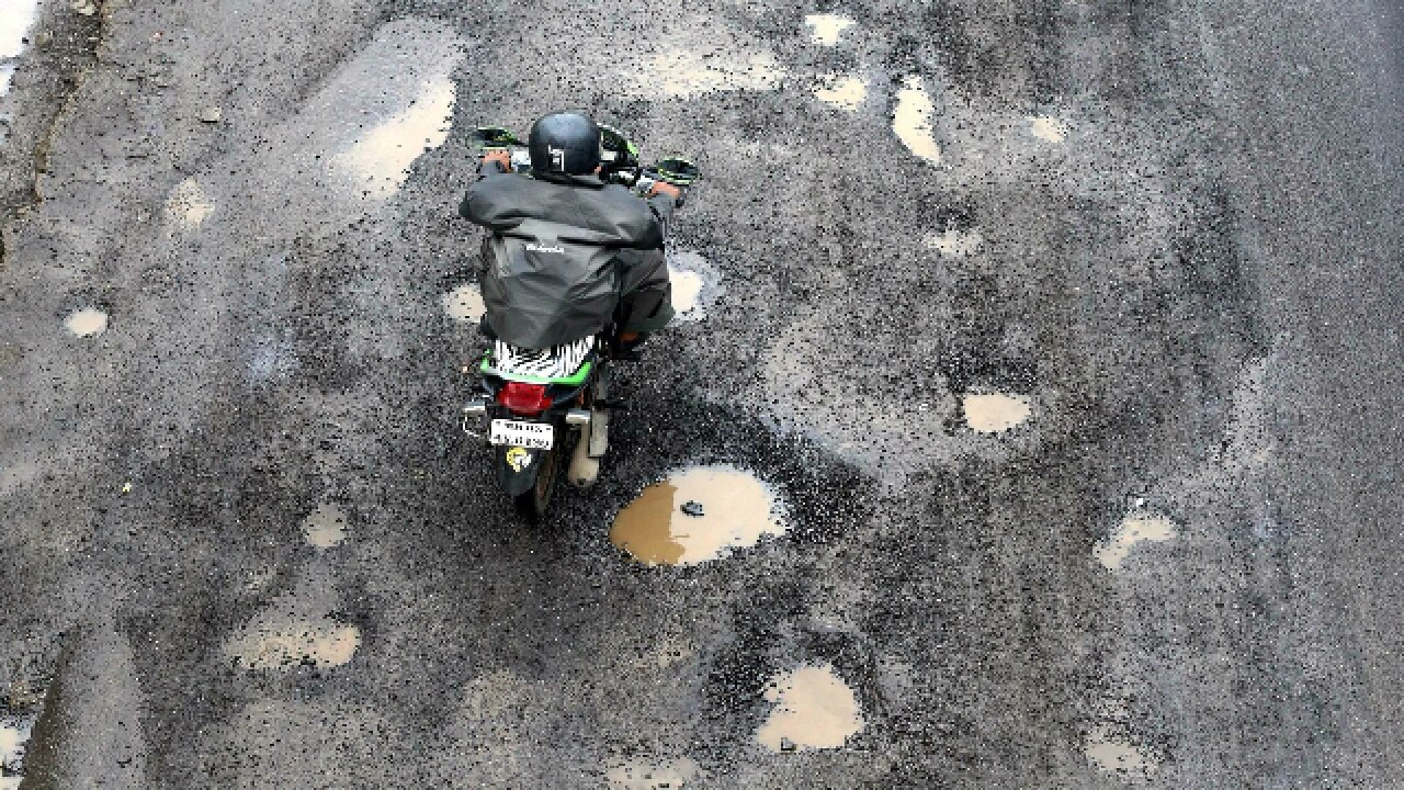 Protests against potholed roads, with some twist