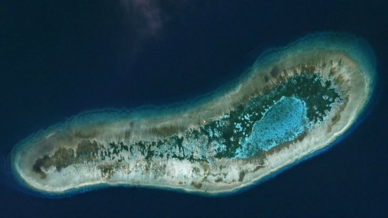 Risking Beijing's ire, Vietnam begins dredging on South China Sea reef