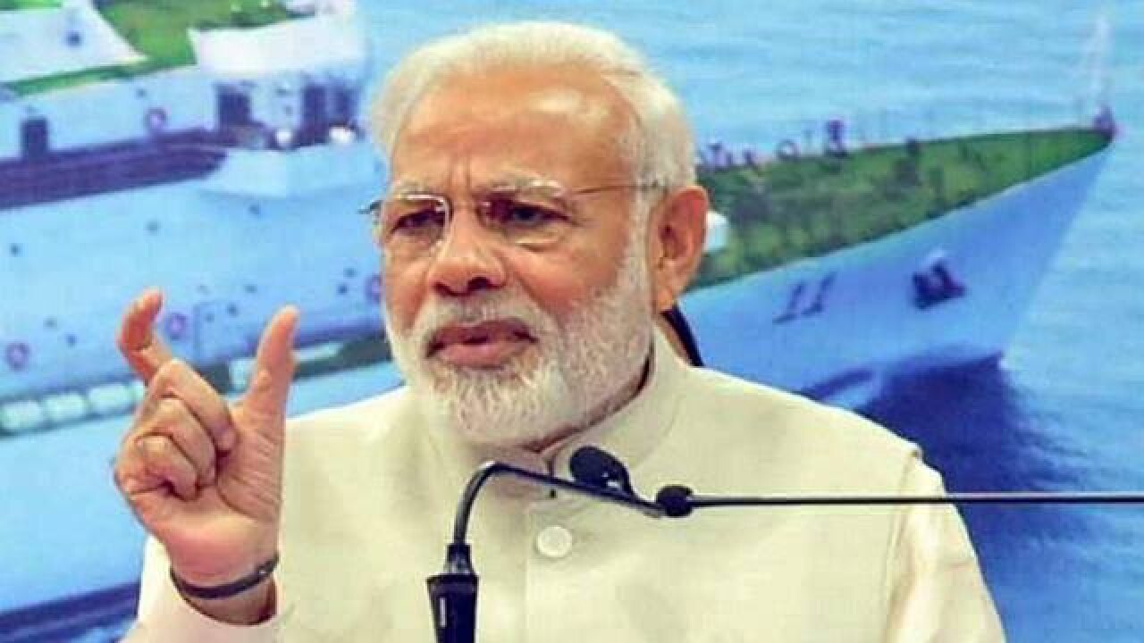 Modi applies balm to demonetization woes, warns dishonest of strict action