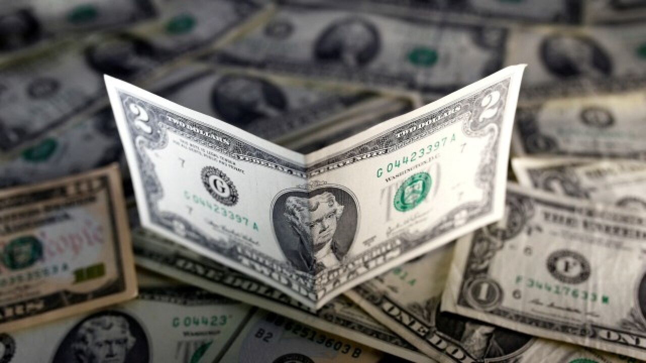 Dollar edges back towards 14-year peak as US debt yields rise
