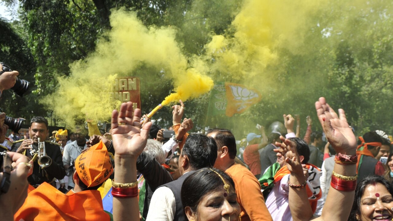 In Pictures | BJP workers paint the sky with the colours of victory for ...