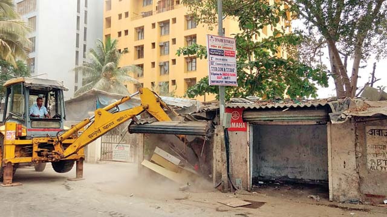 Civic officials start razing drive