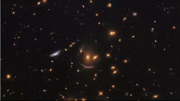 See Pic: NASA's Hubble spots cosmic smiley among colourful galaxies