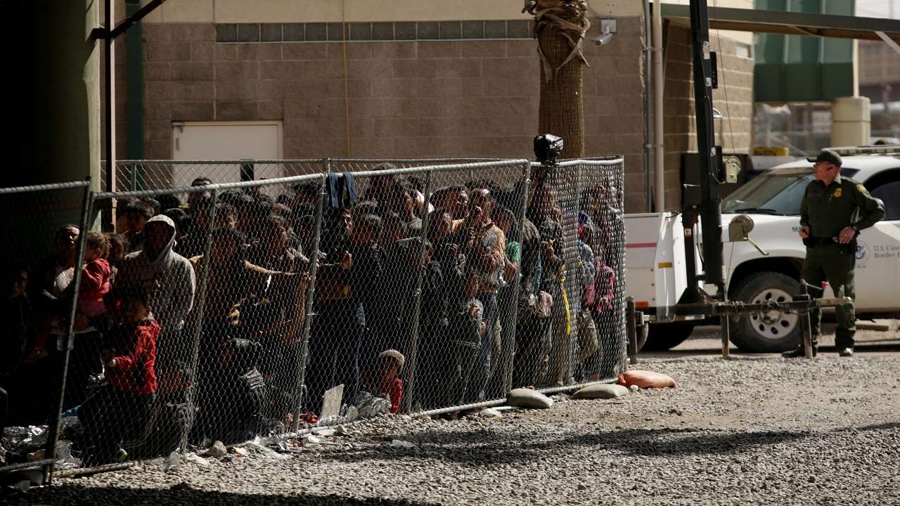 Migrants held in El Paso, Texas, enclosure as surge overwhelms city