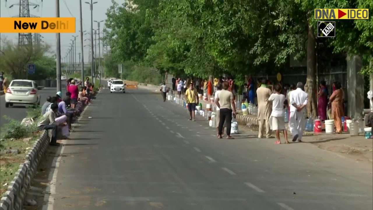 Locals stand in long queues to collect water in Delhi’s Chilla village