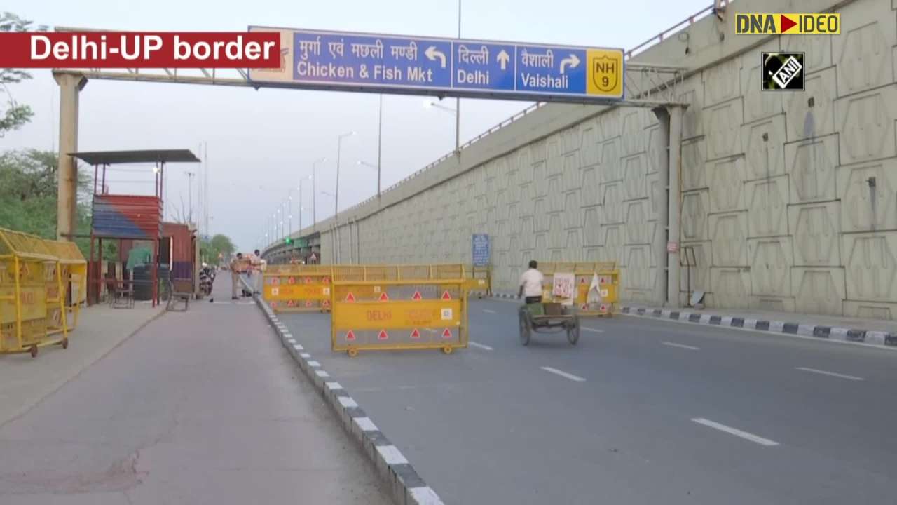 Police personnel check vehicles at Delhi-UP border