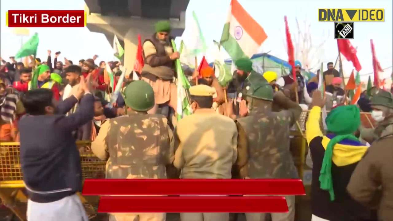 Watch: Farmers break police barricading at Tikri border