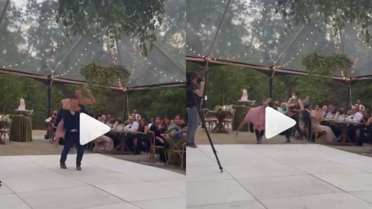 Oops! Bride and groom take hilarious fall from stage while performing ...