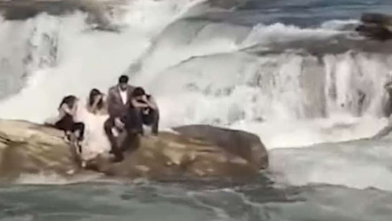 Pre-wedding shoot goes horribly wrong as couple gets stuck in waterfall