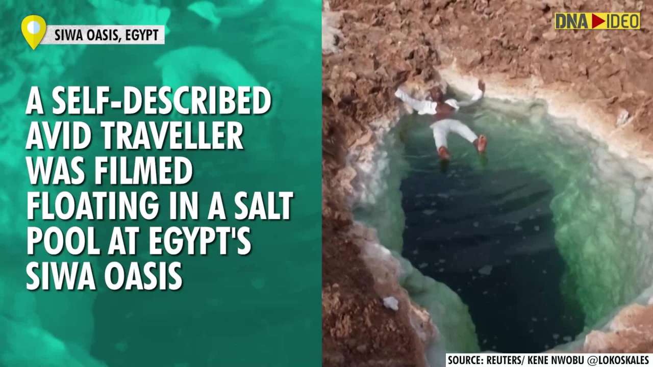 Traveller floats in Egypt's Siwa Oasis salt pool