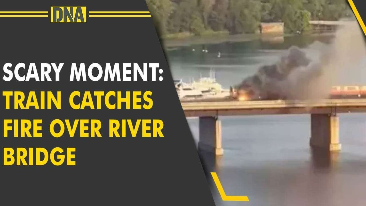 On Cam: Train catches fire atop bridge, passengers jump through windows
