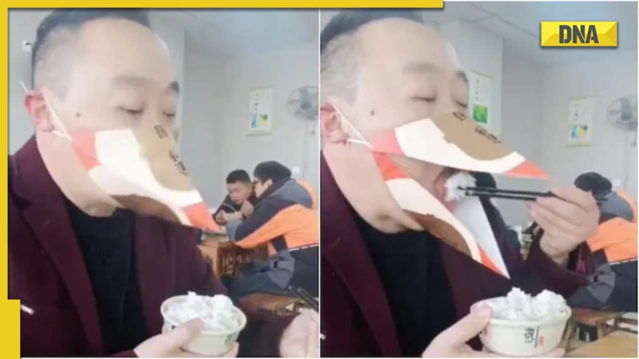 Chinese man eats food wearing beak-shaped mask amid Covid-19 scare ...