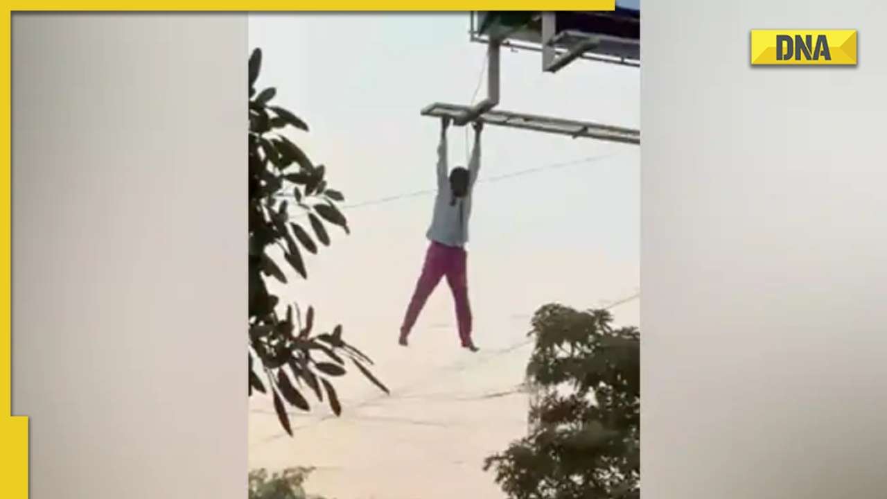 Video of drunk man hanging from a billboard frame in Telangana goes viral