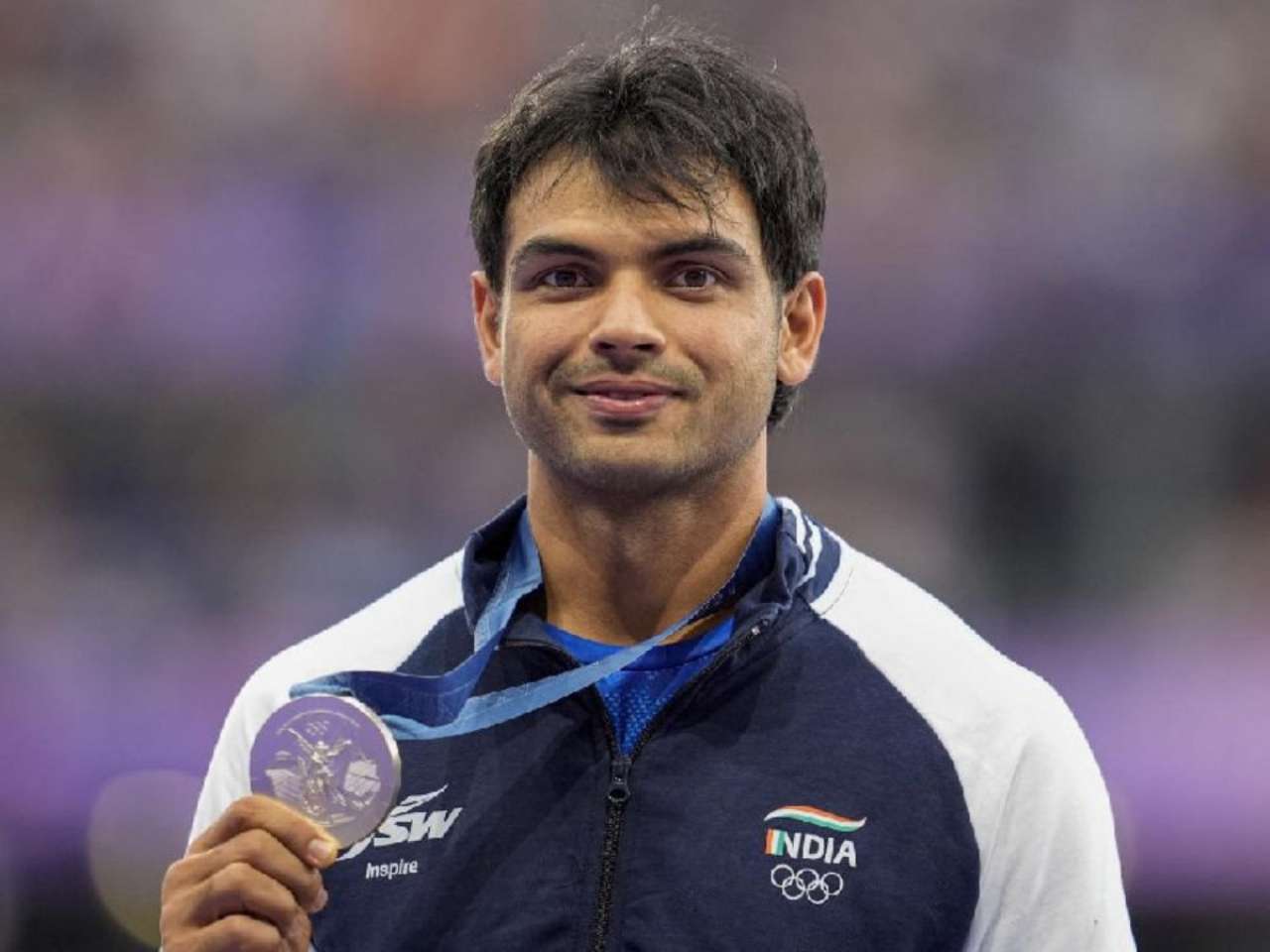 What is the age difference between Neeraj Chopra and his wife Himani Mor?