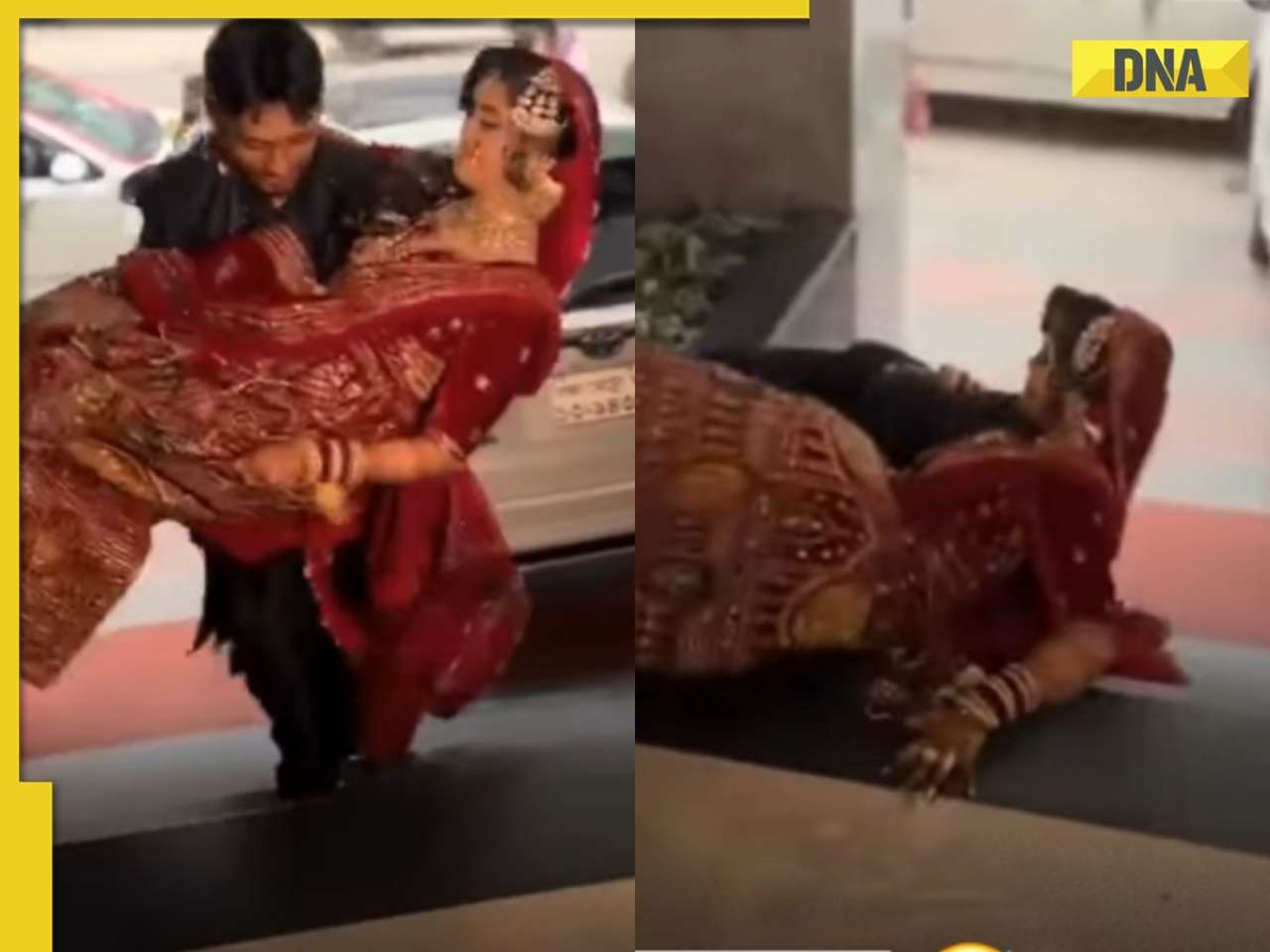 Grand wedding entry turns awkward as groom lifts bride and falls, video ...