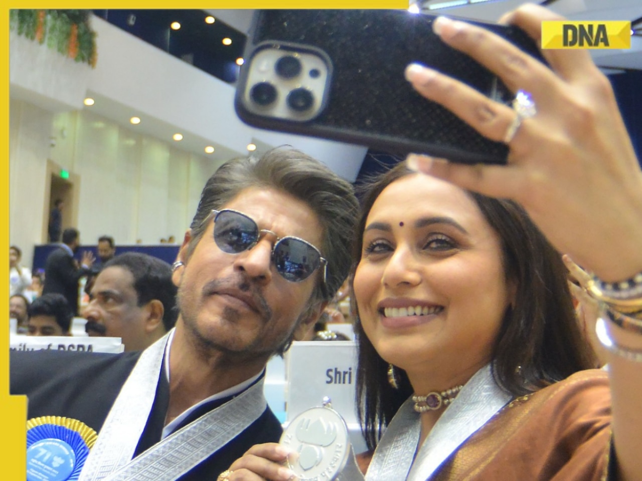 Viral Video Shah Rukh Khan Holds Rani Mukerjis Pallu Fixes Her Hair At 71st National Film