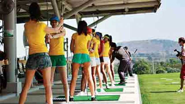 Here, female caddies egg you on