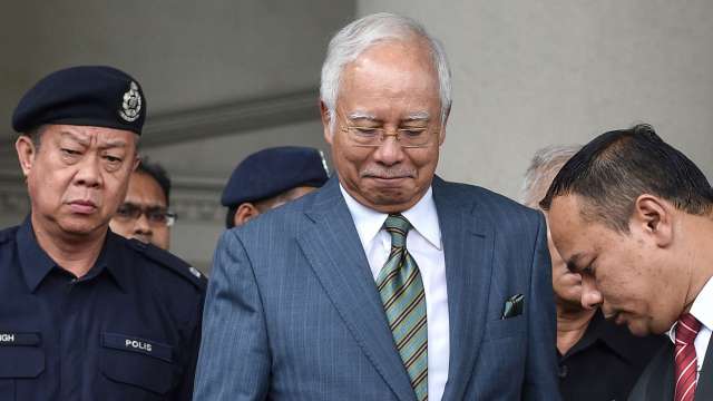 Malaysia's ex-PM Razak pleads not guilty to money laundering charges